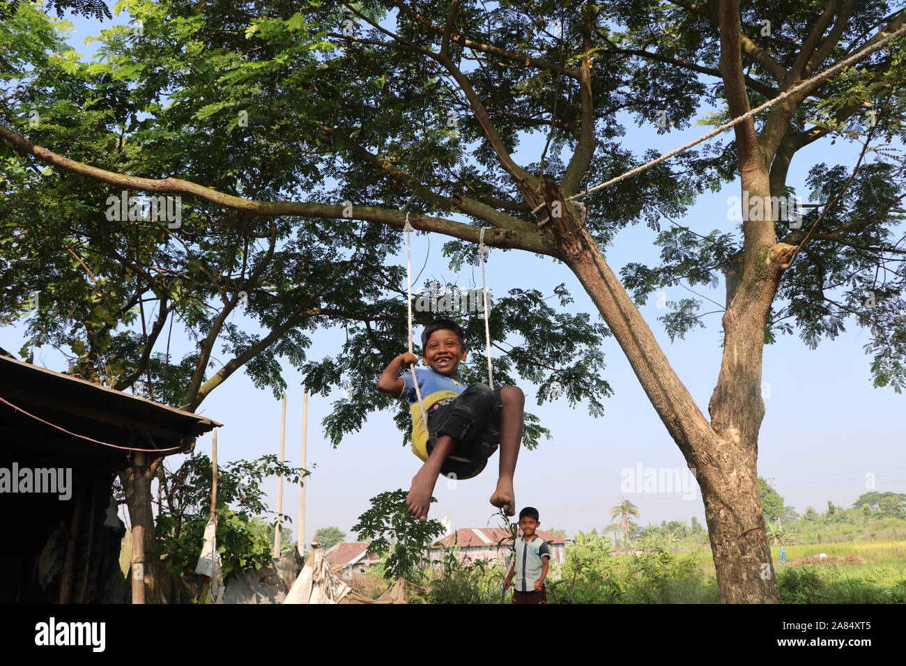 Bangladesh children playing 1nov2019,A child is swinging in his mind to ...