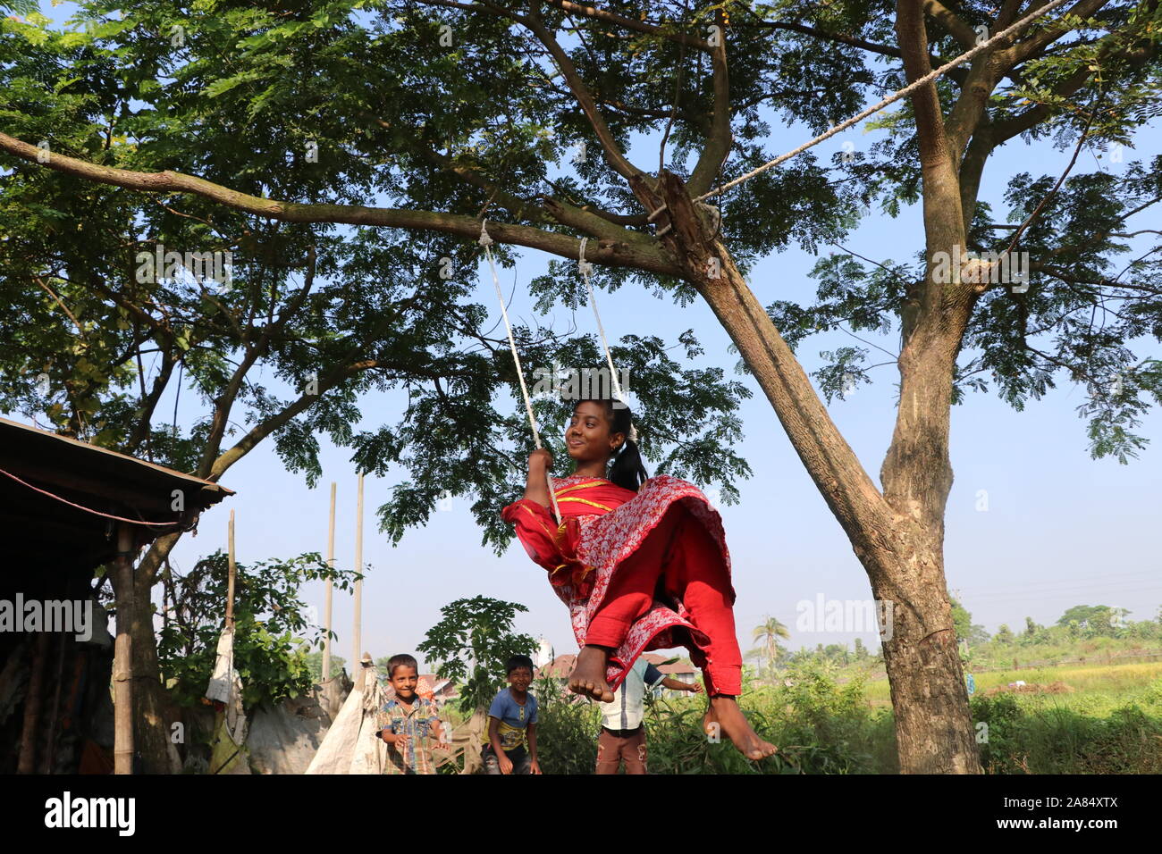 Bangladesh children playing 1nov2019,A child is swinging in his mind to ...