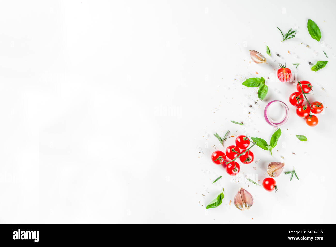 Flatlay with greens, herbs and spices on white background. Frame design ...