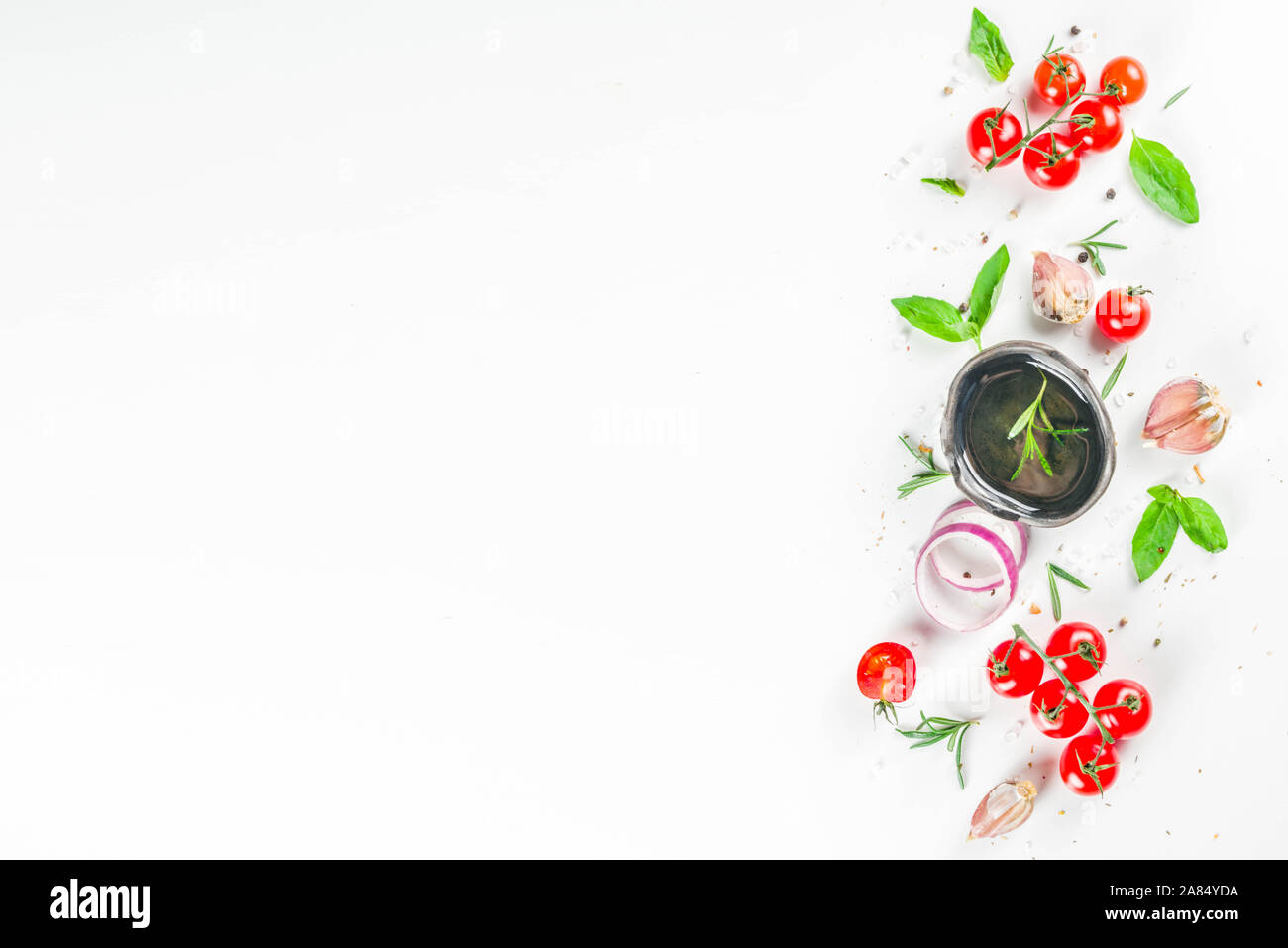 Flatlay with greens, herbs and spices on white background. Frame design ...