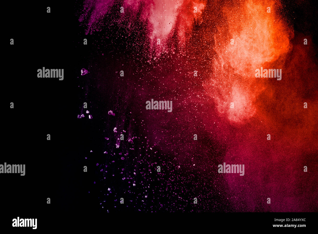Orange red powder explosion on black background.Orange red color dust ...