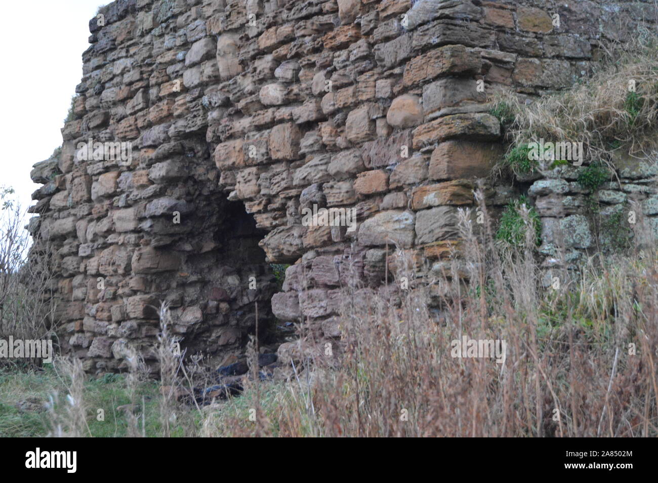 Red Sandstone of ruined Seafield Tower onear Kirkcaldy on Fife Coastal ...