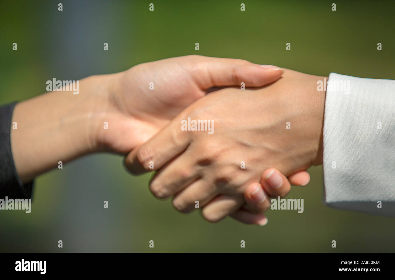 Close-up on woman hands shaking in public Stock Photo - Alamy