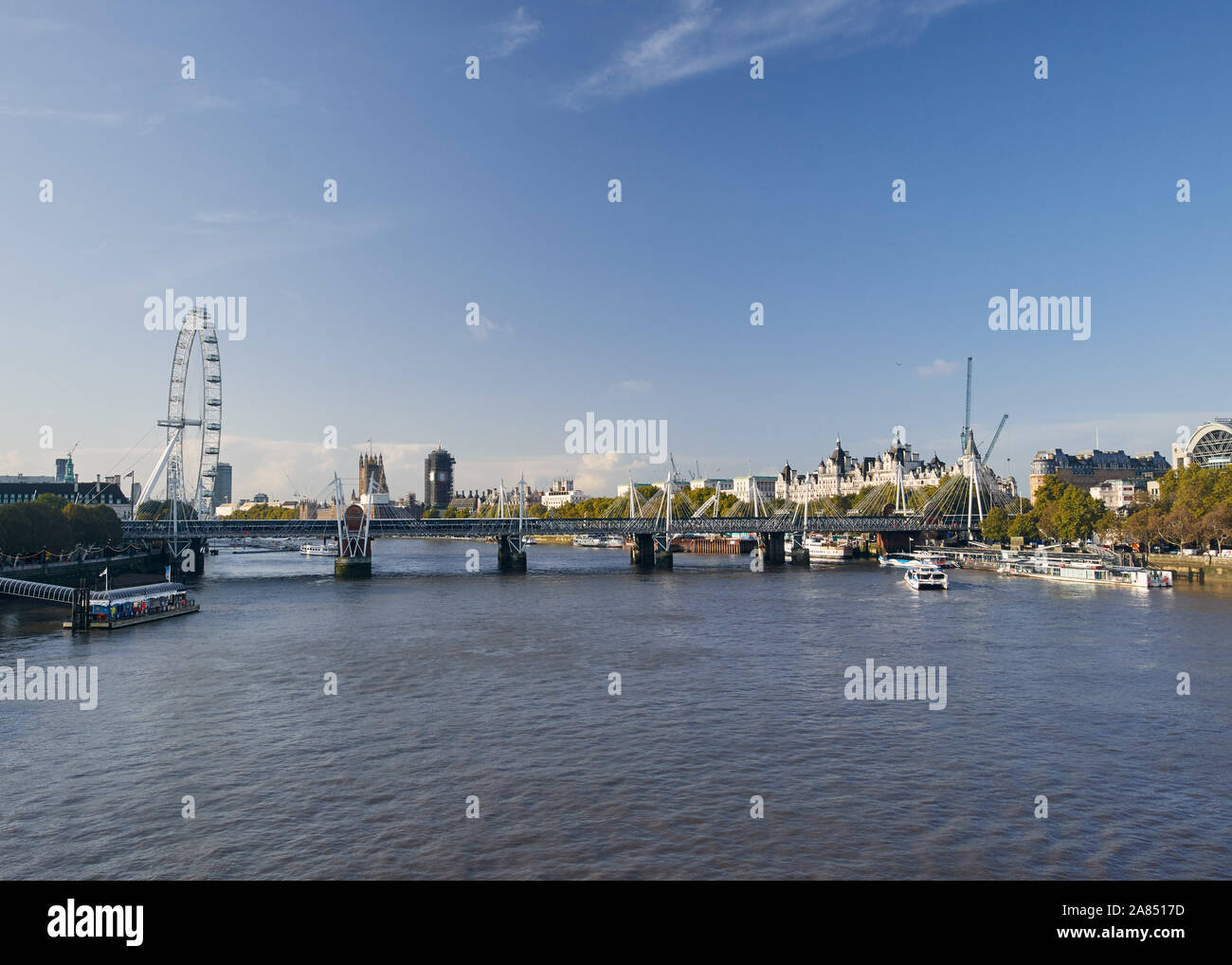 A view of Hungerford Bridge from Waterloo Bridge with the London Eye ...