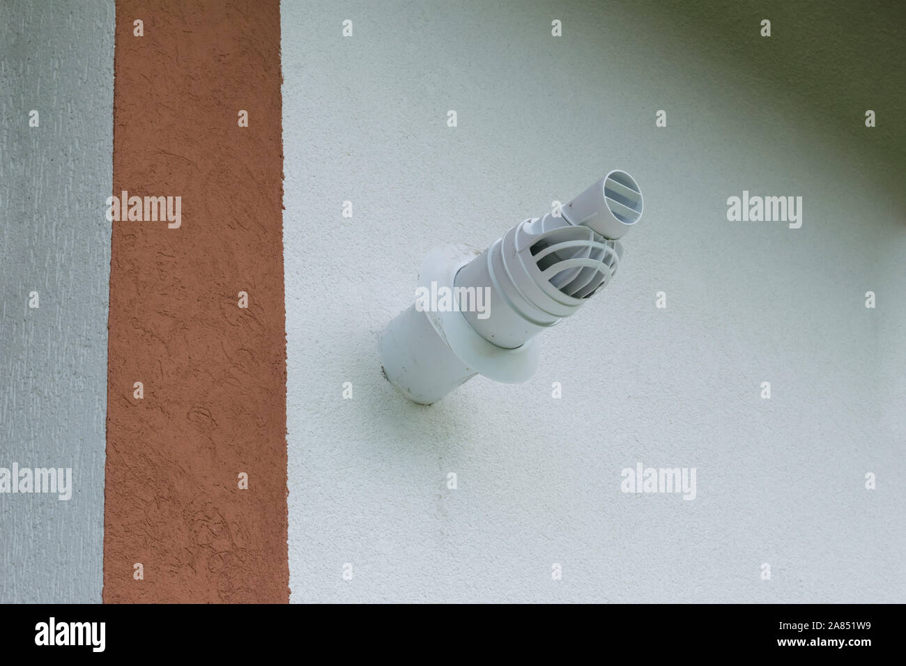 a condensation gas boiler ventilation pipe on the exterior of a house ...