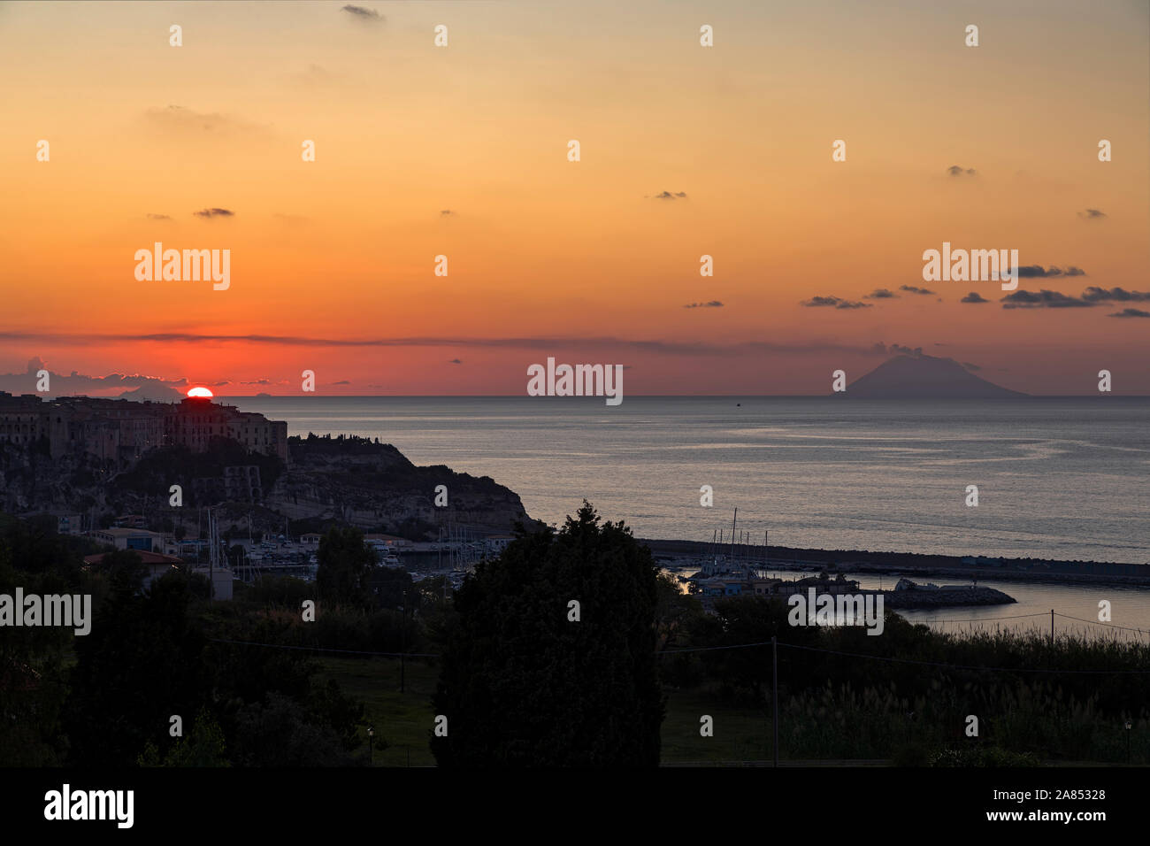 third in sequence of five images of sunset over ocean at tropea italy ...
