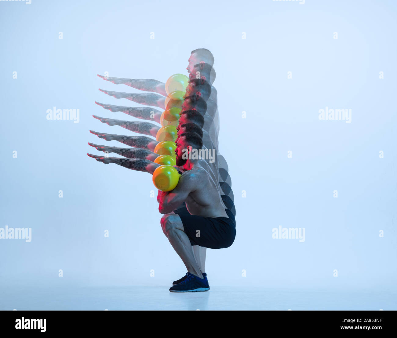 New me. Young caucasian bodybuilder training over studio background in ...