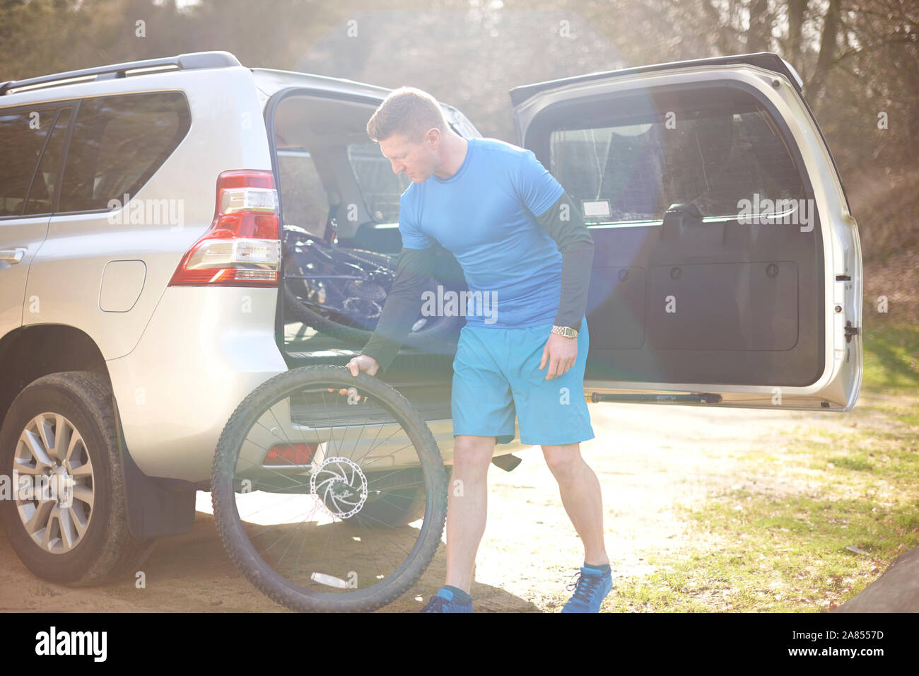 Car parking lot with cyclist hi-res stock photography and images - Alamy