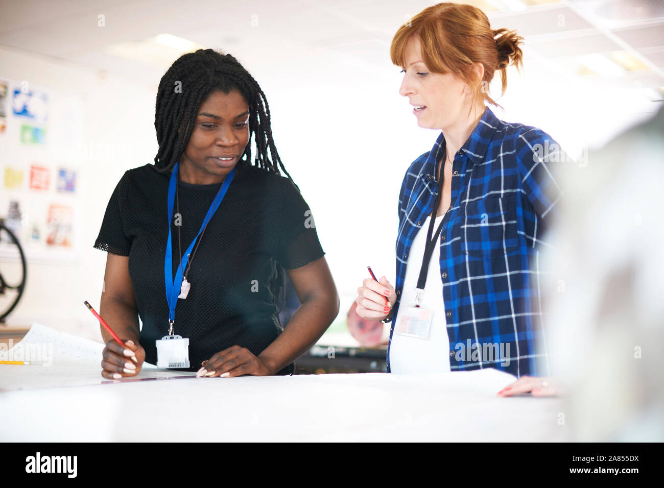 Tailor teaching skill discussing hi-res stock photography and images ...