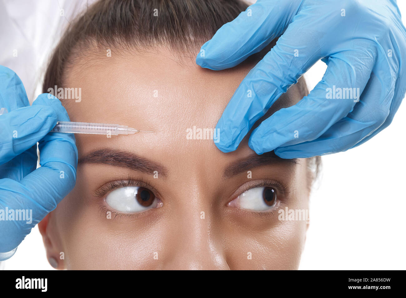 Closeup Portrait of young Caucasian woman getting cosmetic injection in ...