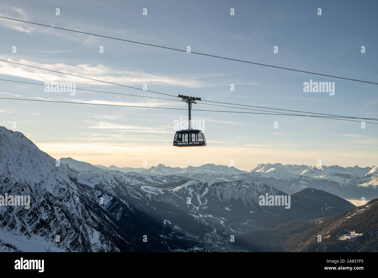 Telepherique cable car in the air on the way up to Aiguille du plan ...