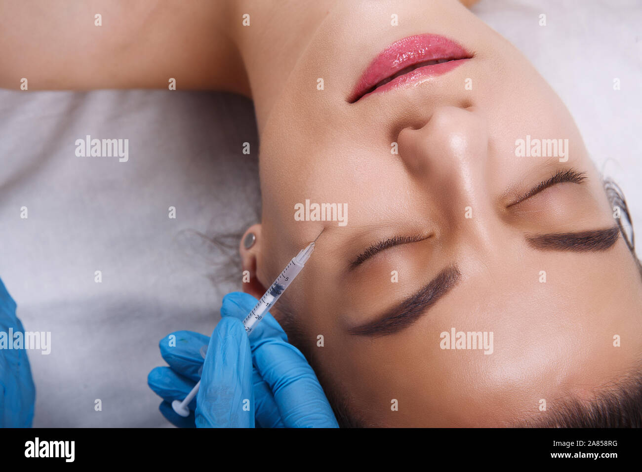 Facial Beauty Injections. Portrait Beautiful Young Woman Receiving ...