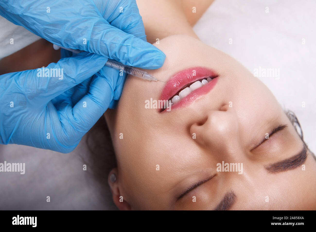 Facial Beauty Injections. Portrait Beautiful Young Woman Receiving ...