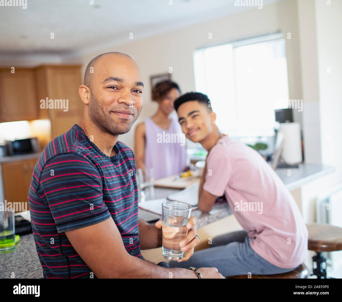 Portrait smiling family in kitchen Stock Photo - Alamy