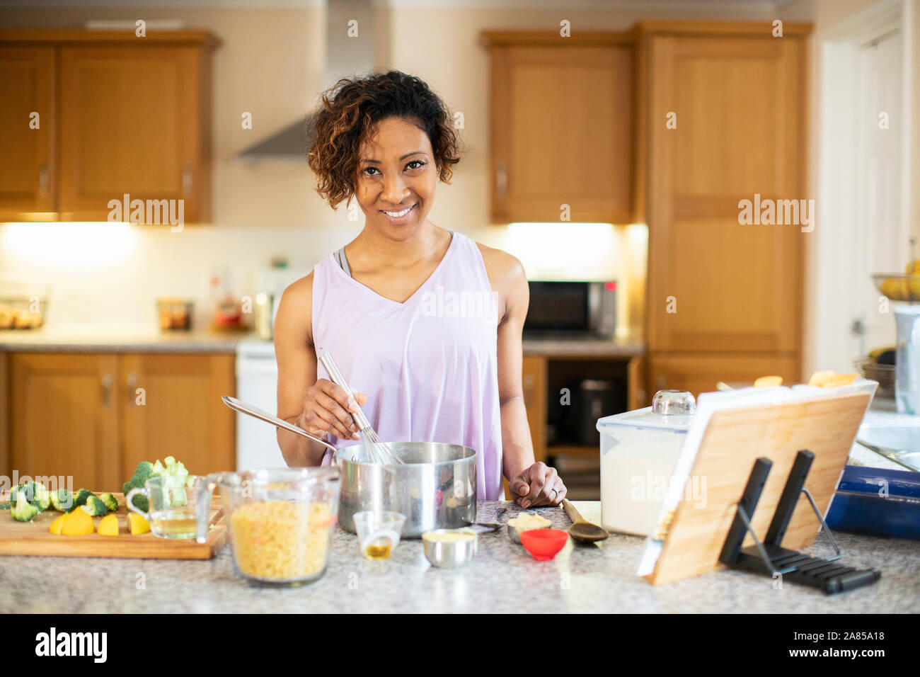 Portrait confident woman cooking in kitchen Stock Photo - Alamy