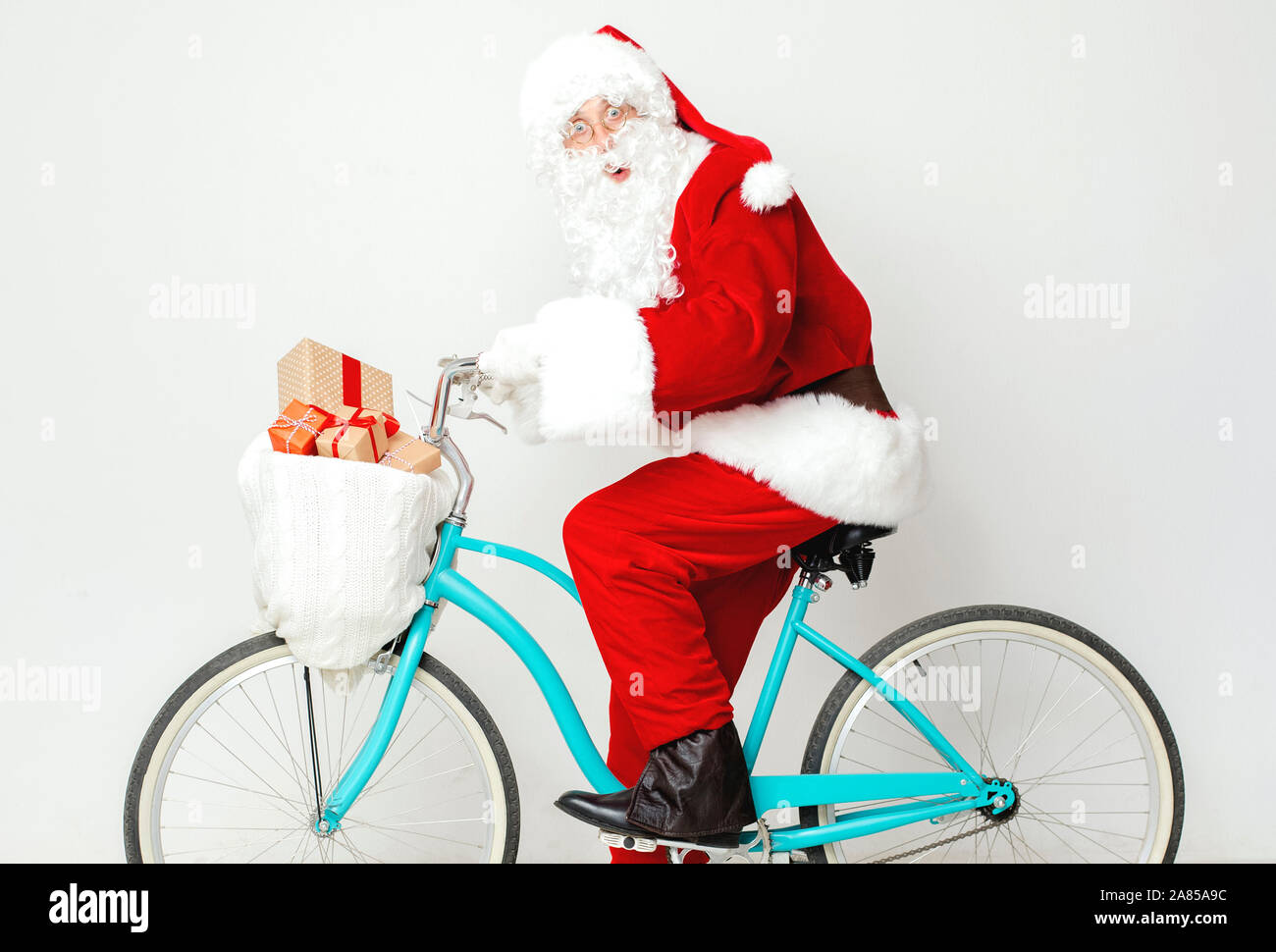 Santa riding bike hi-res stock photography and images - Alamy