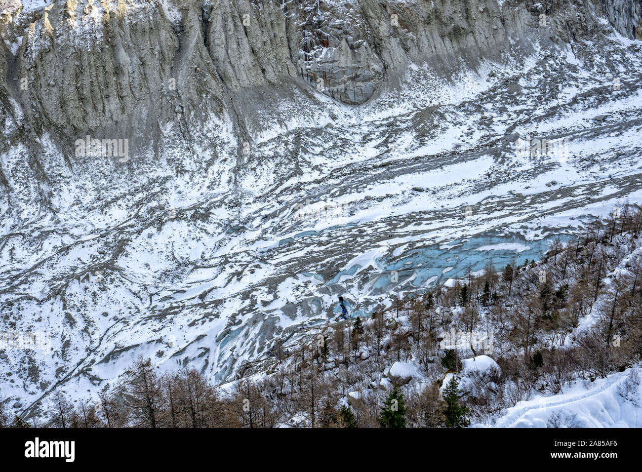 Visiters enterning ice cave under massive glacier near Chamonix in ...