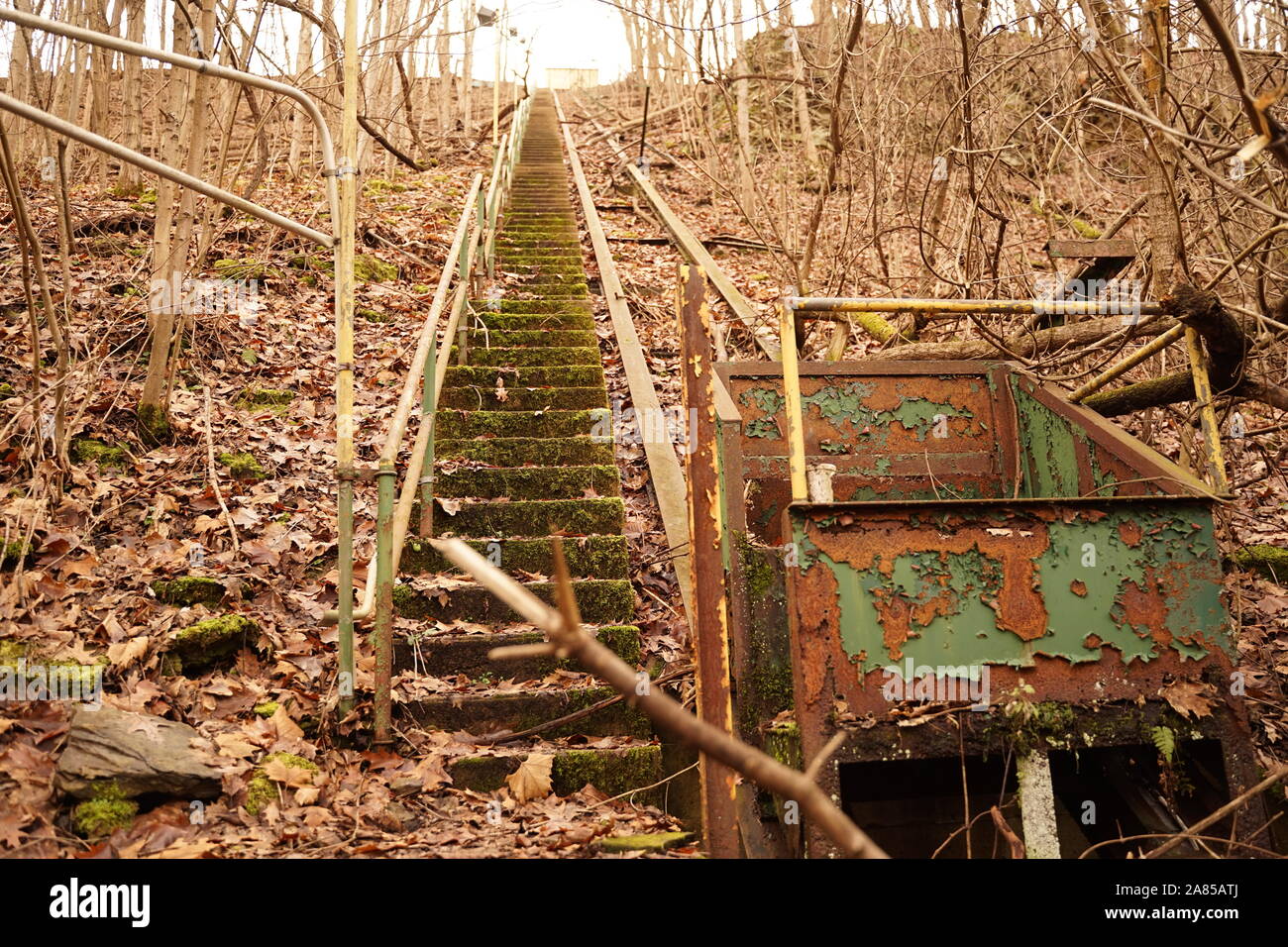 Rusty mining cart leading up stairway Stock Photo - Alamy