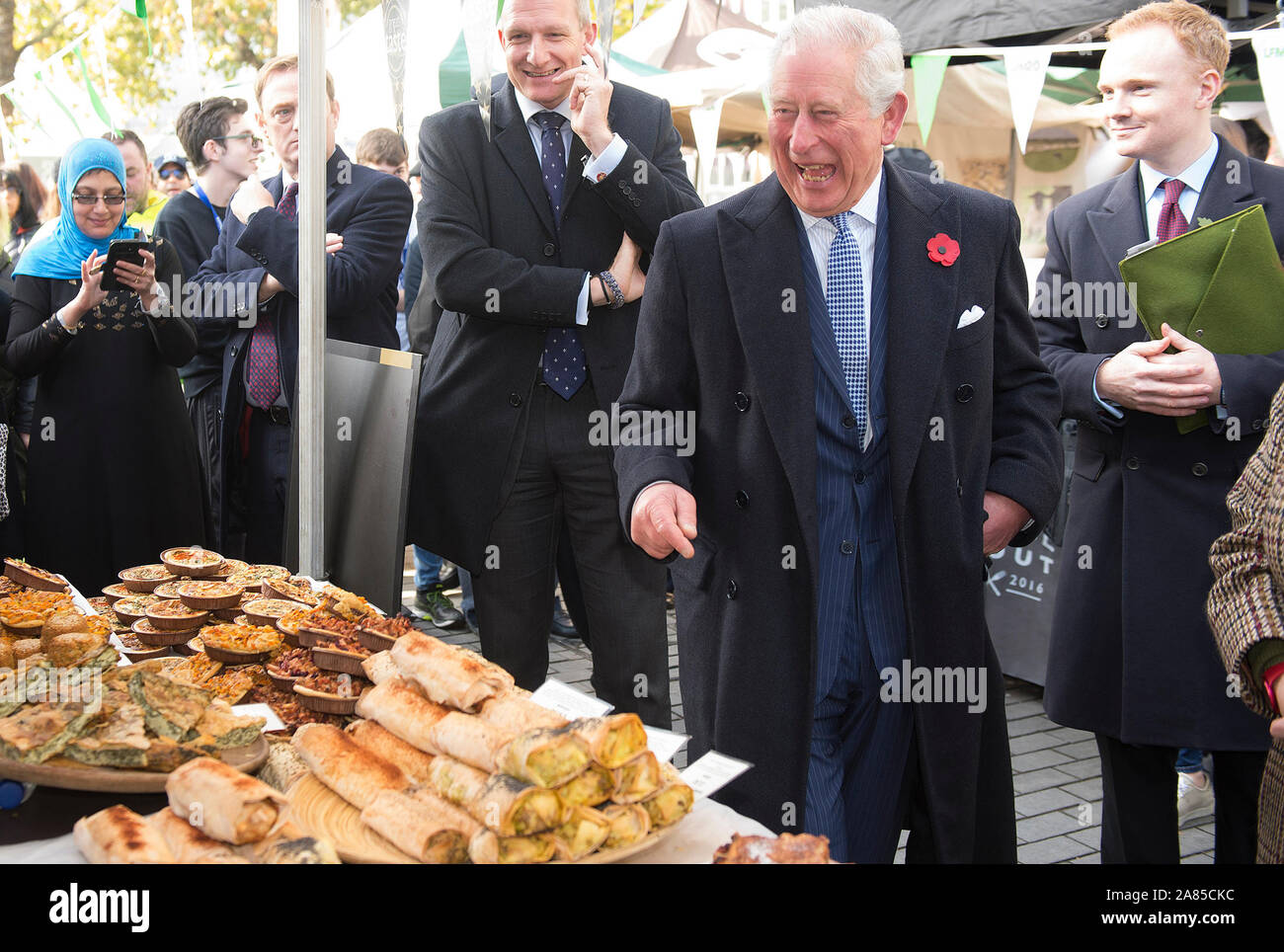 The Prince of Wales at the Popina Bakery stall during a visit to Swiss ...