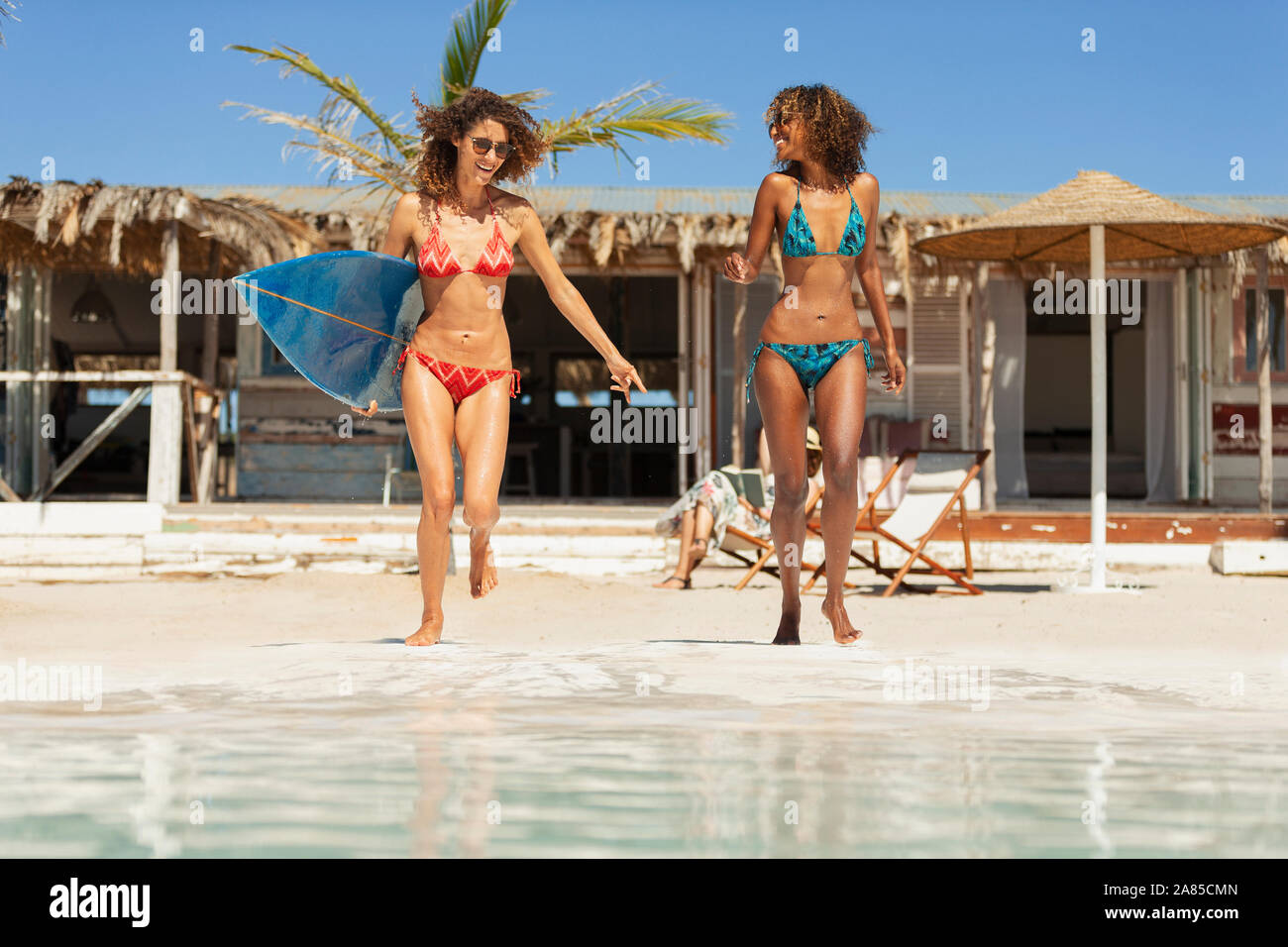 Woman running beach bikini hi-res stock photography and images - Alamy