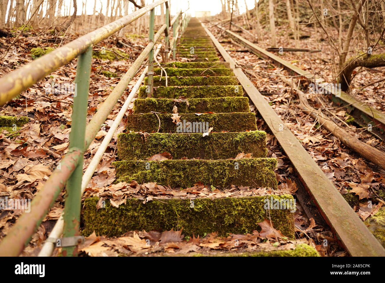 Abandoned graffiti tunnel with old mining stairs and conveyor system ...