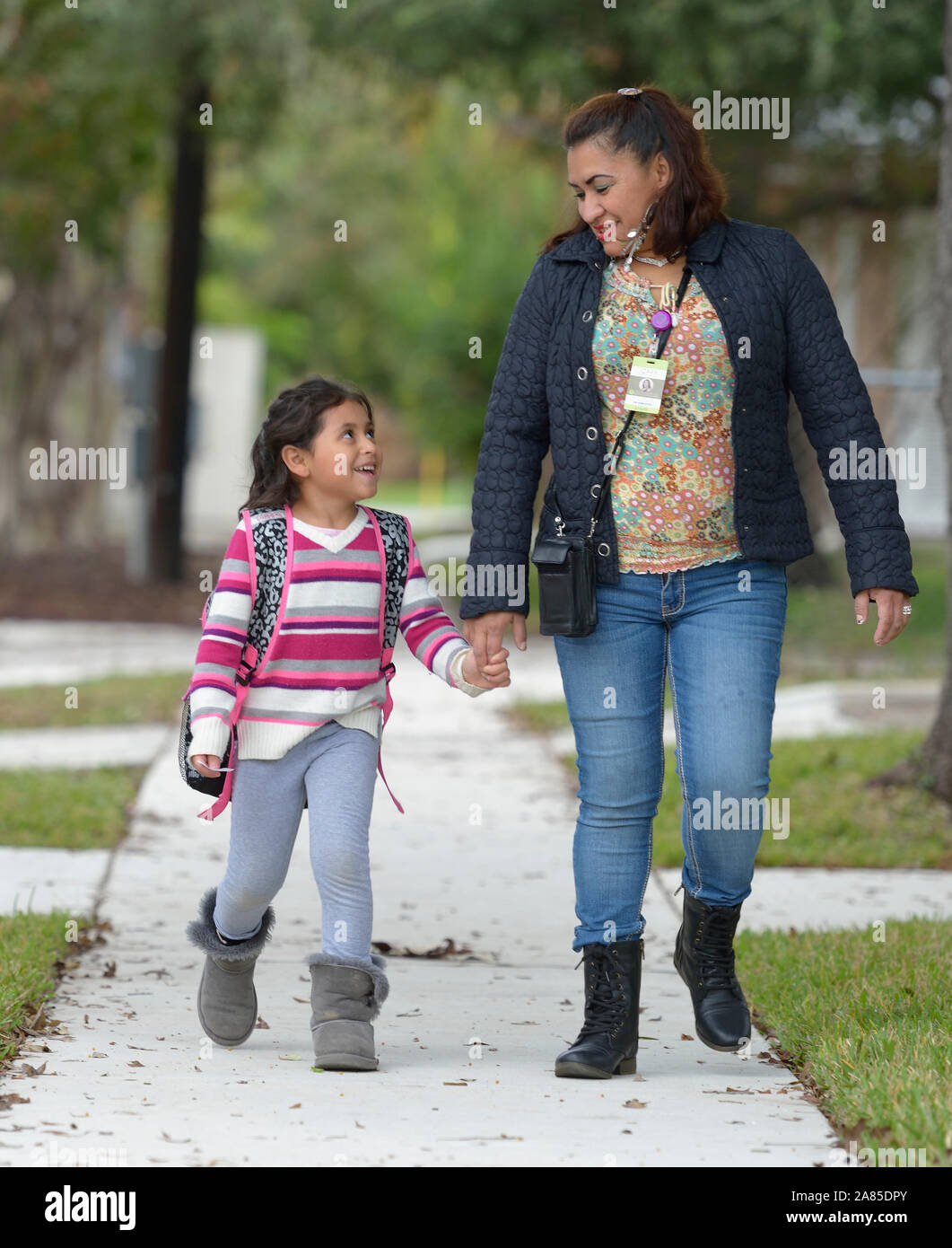 Yanira Lopez walks her daughter Melany home from school in San Antonio ...