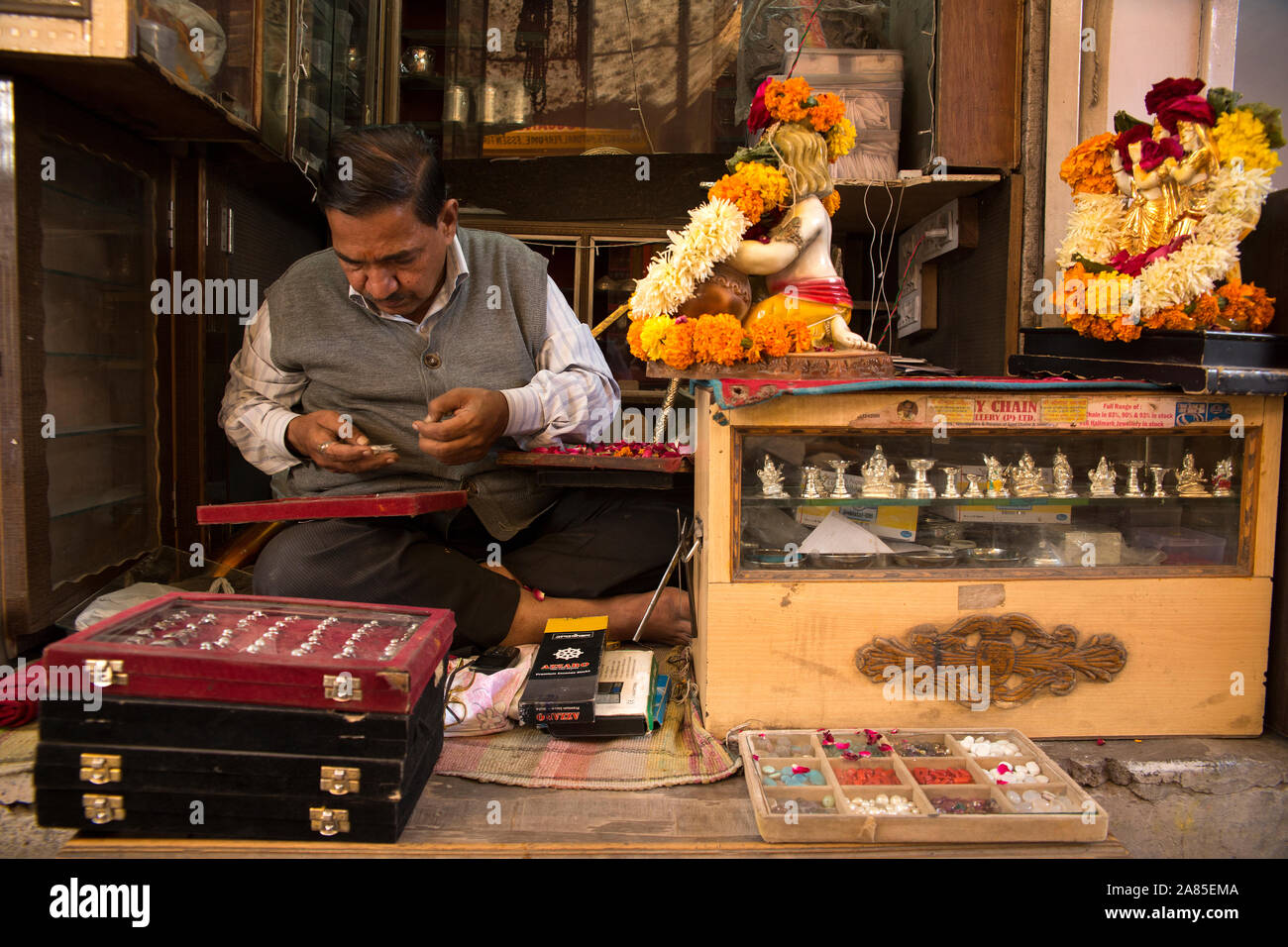 INDIA/Rajasthan/Jodhpur/January 2016: A jeweler in Sarafa bazaar plies ...