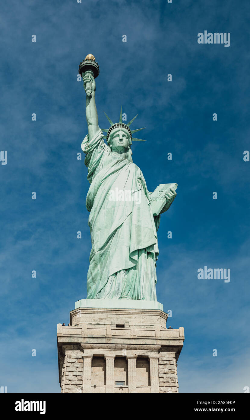 Front view of Statue of Liberty against blue sky in New York City Stock ...