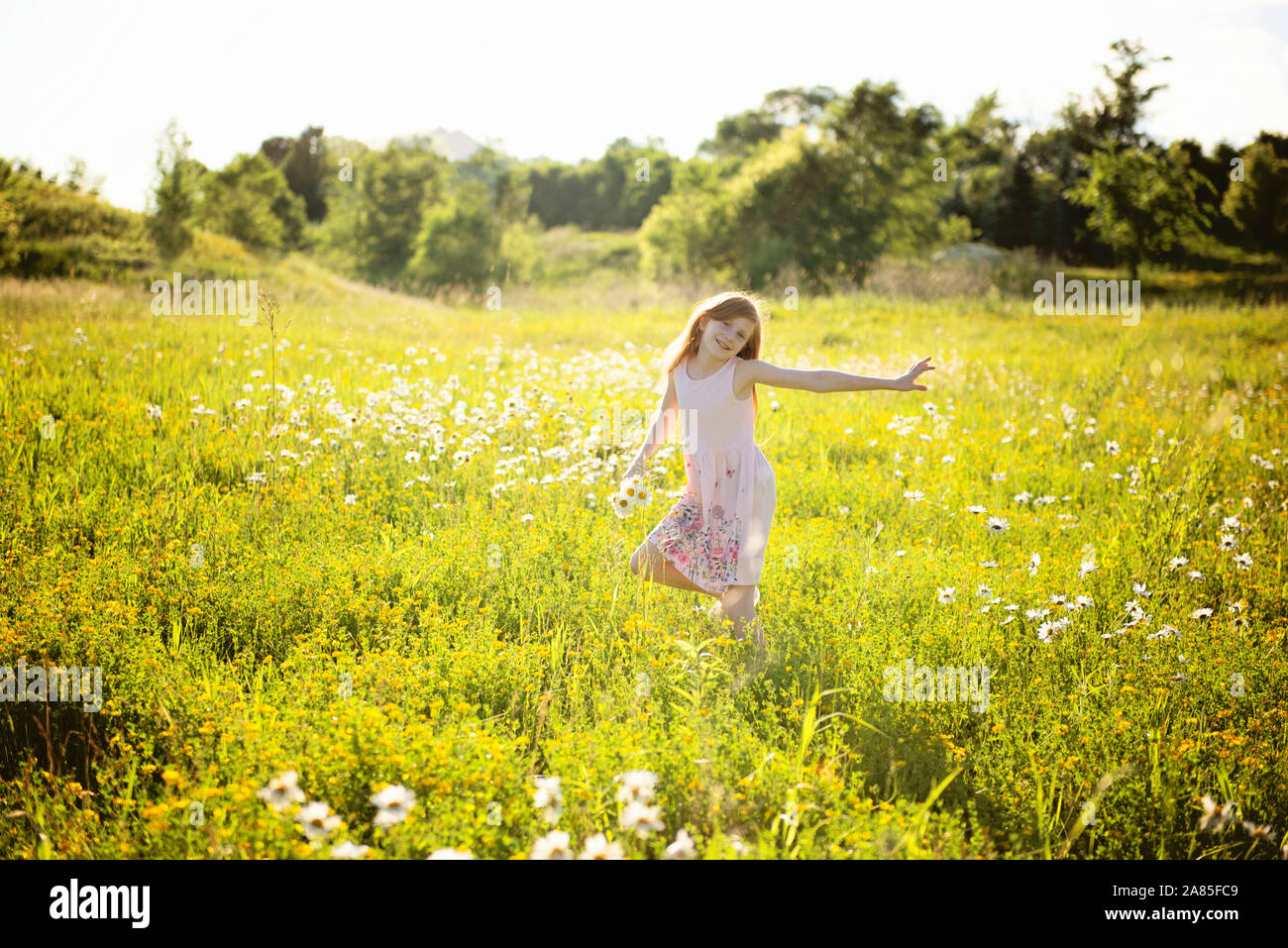 Girl happy skipping hi-res stock photography and images - Alamy