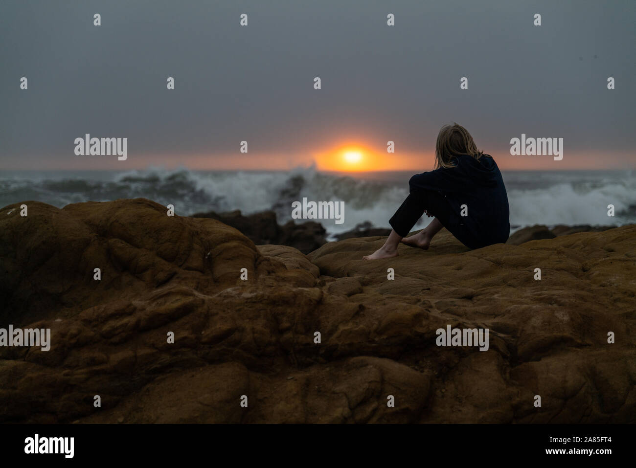 Teenager looking out at the horizon hi-res stock photography and images ...