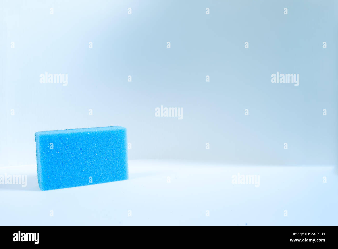 single blue kitchen sponge islated on a white background Stock Photo ...