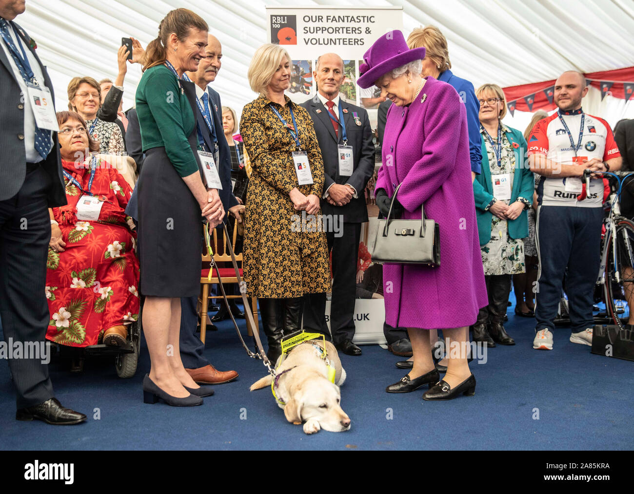 Queen Elizabeth II meets RBLI volunteer Kate Bosley while her guide dog ...