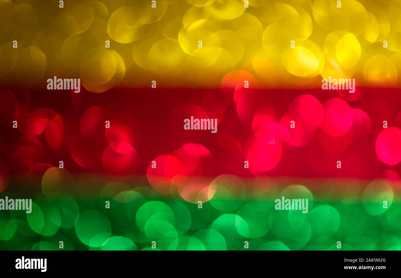 Abstract glitter three color lights background. de-focused. yellow, red ...