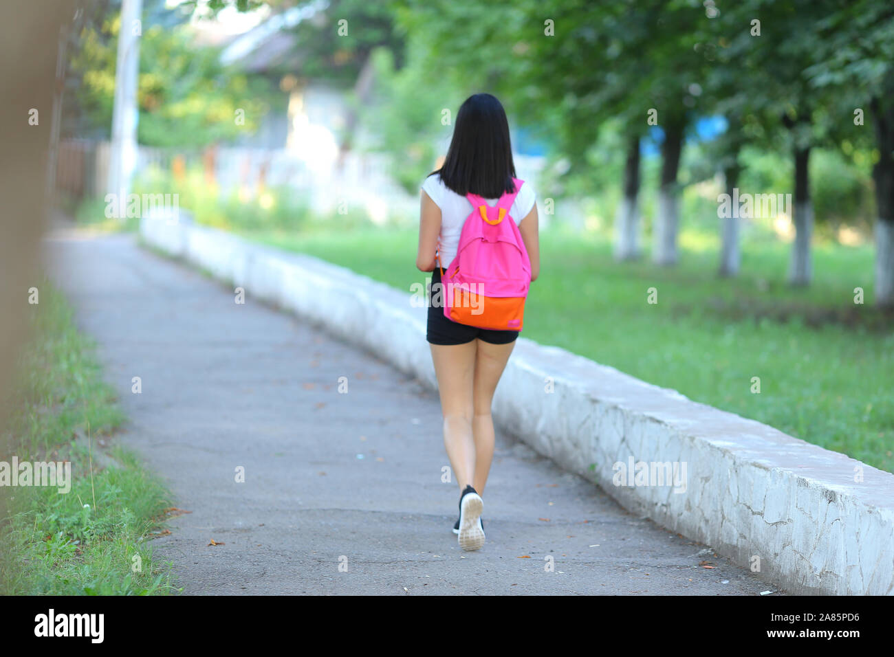 Young girl walking in the park are walking gait Stock Photo - Alamy