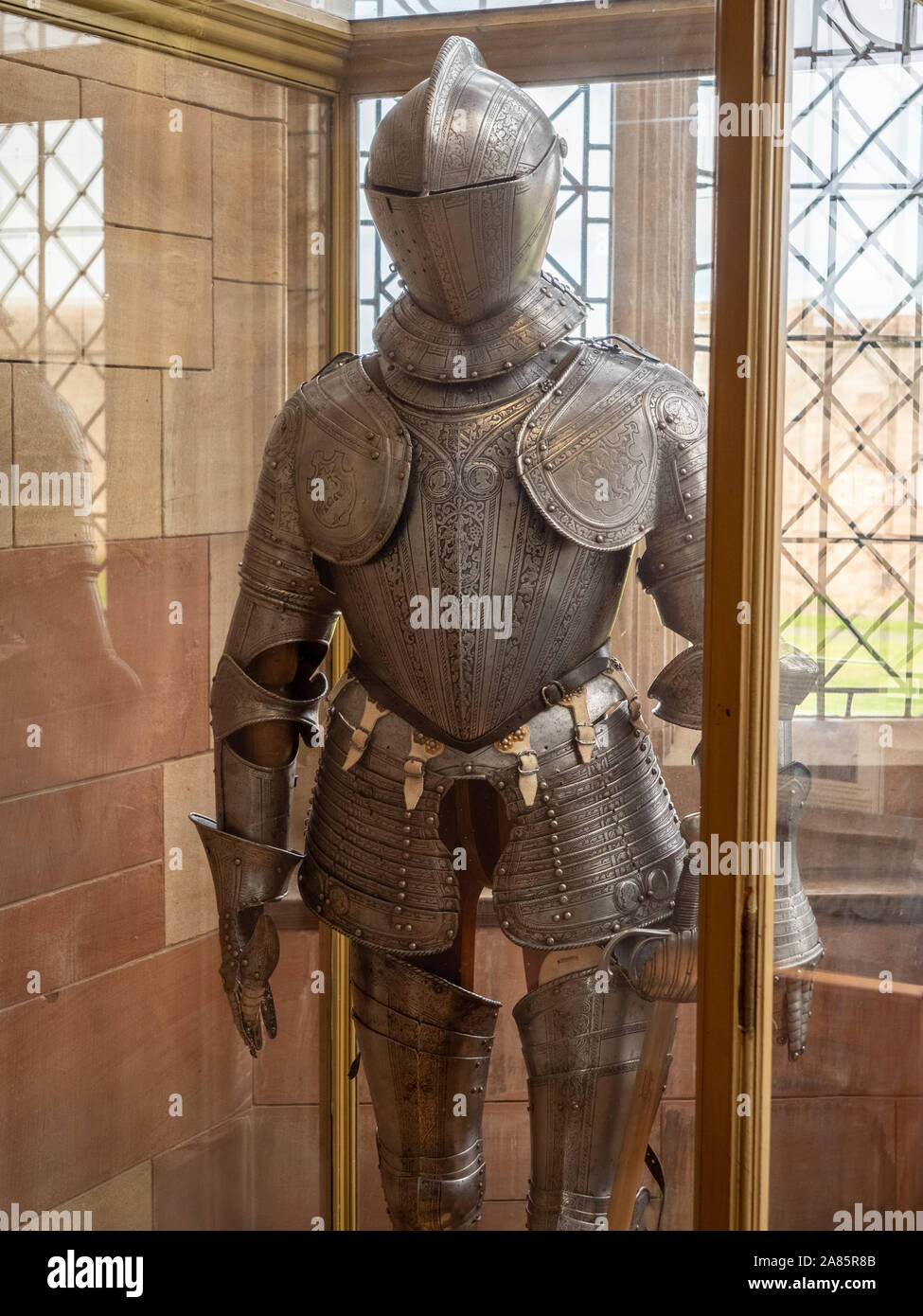 Suit of armour in display case at Bamburgh Castle, Northumberland, UK ...