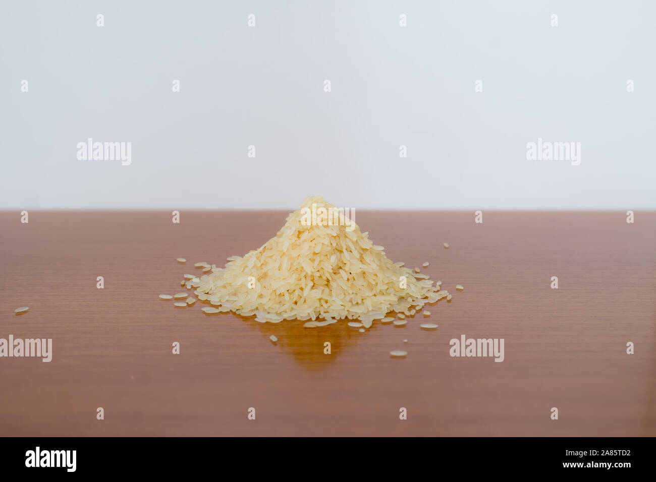 White rice sprinkled in lump on a table Stock Photo - Alamy