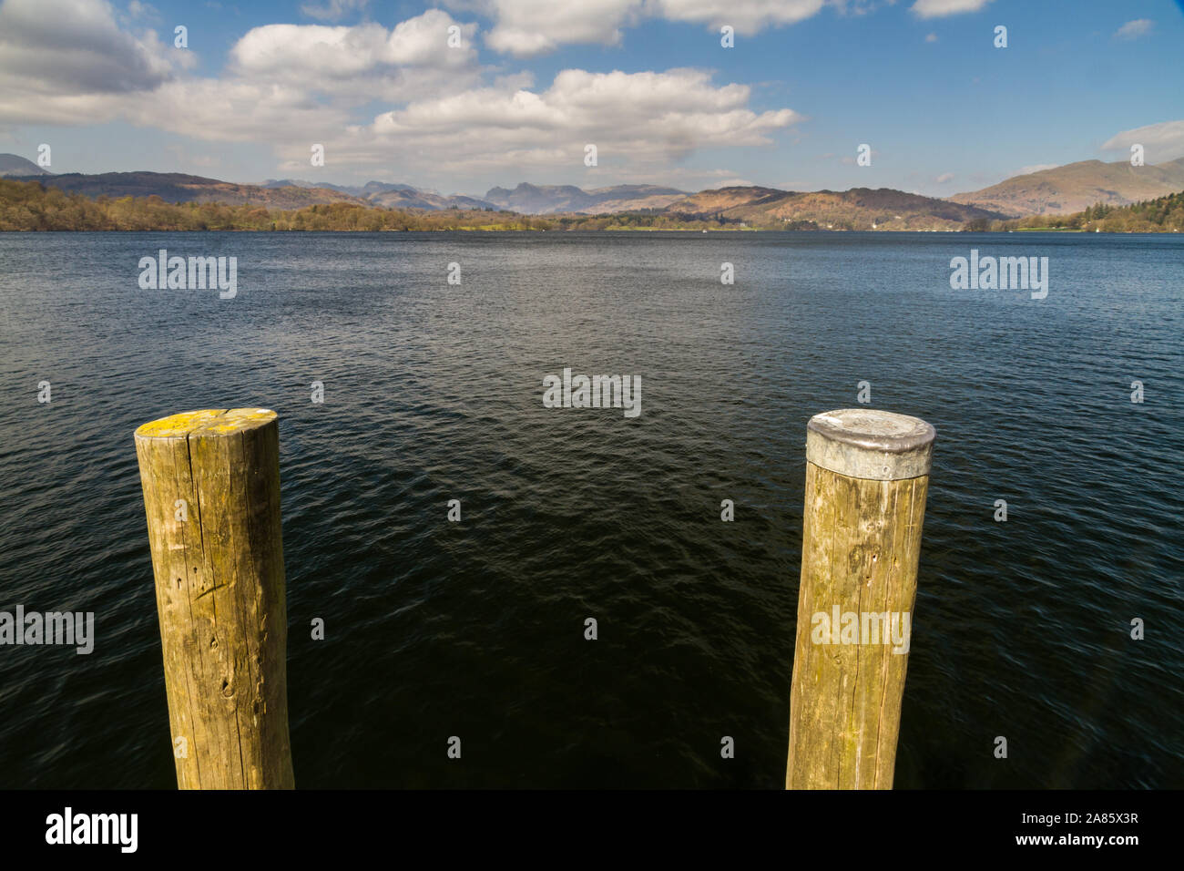 Mooring posts with lake Windermere and mountains behind, landscape ...