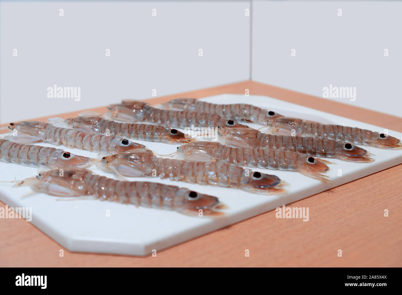 Raw mantis shrimps on the kitchen cutting board Stock Photo - Alamy