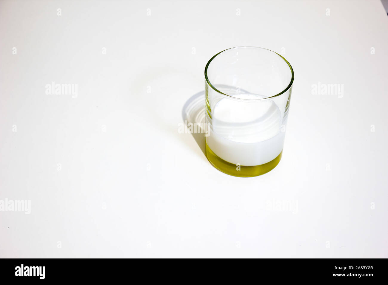 Glass beaker full of milk on the table Stock Photo - Alamy