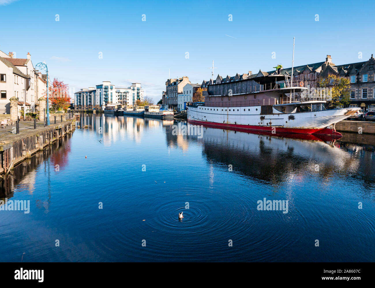 Reflections in Water of Leith river with conversion of Ocean Mist ship ...