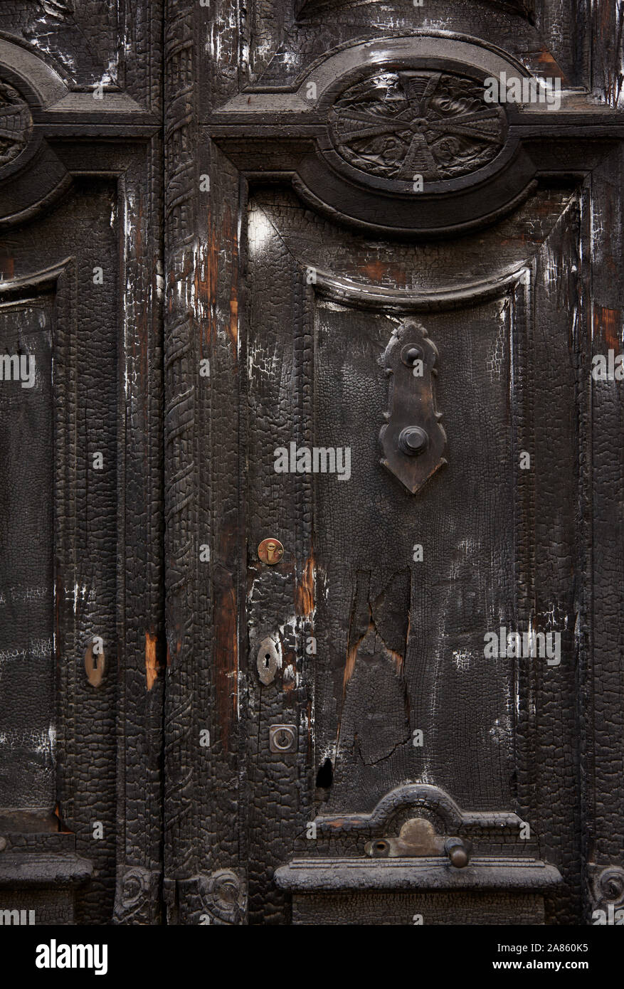 Charred front door of property in Valencia, Spain Stock Photo - Alamy