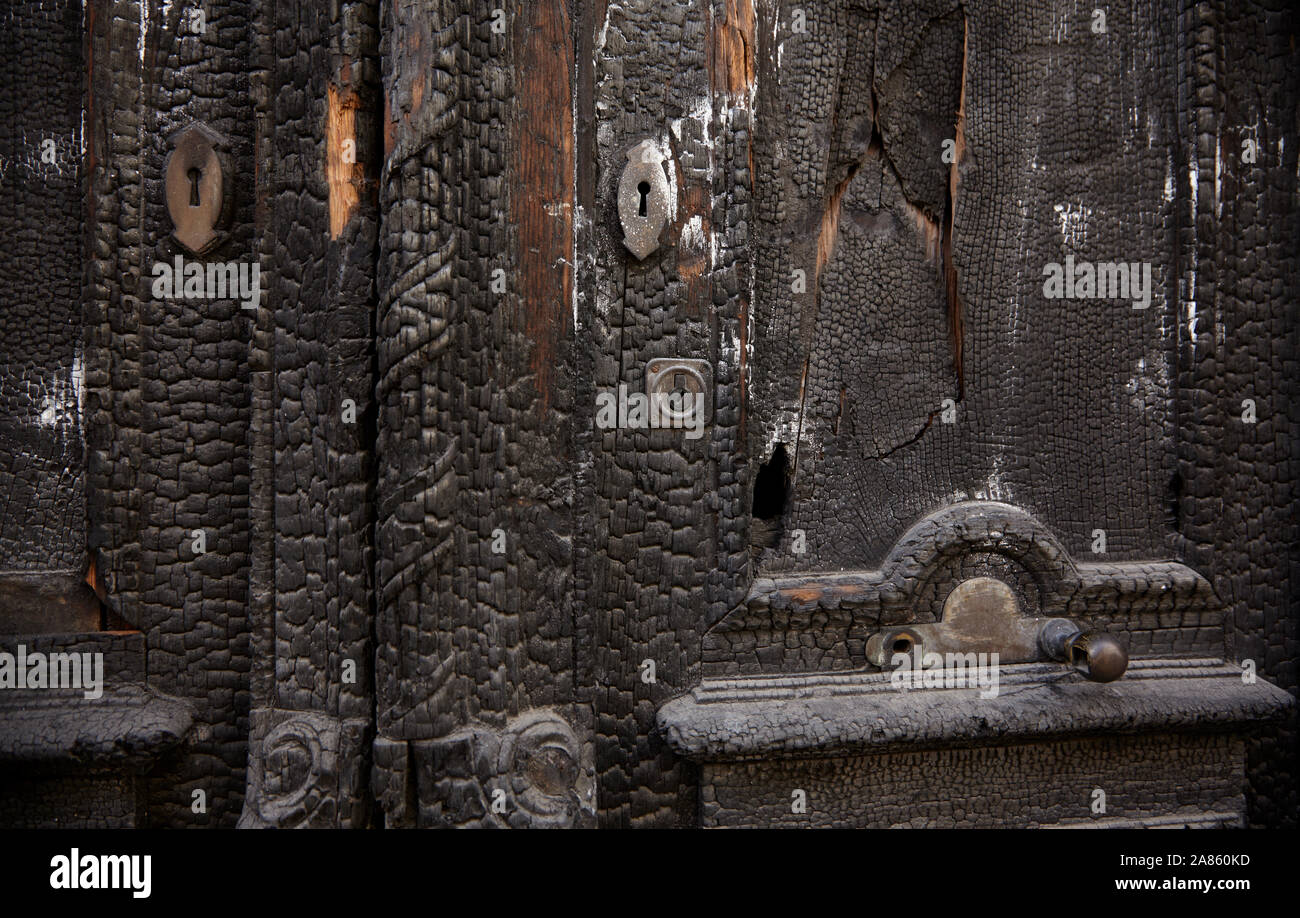 Charred front door of property in Valencia, Spain Stock Photo - Alamy