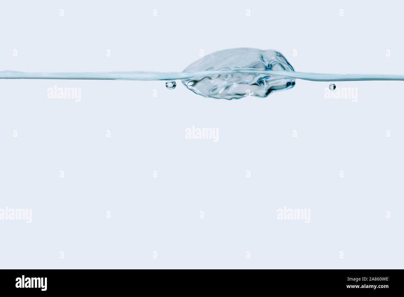 Studio shot of different bubbles at the water surface in side view in ...