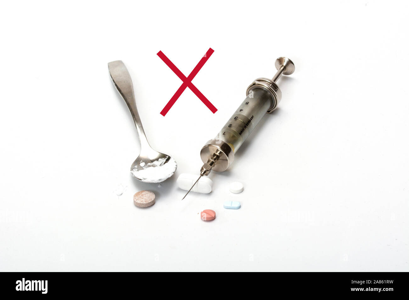 Let`s give up the deadly drugs, with pills and a spray on a white ...