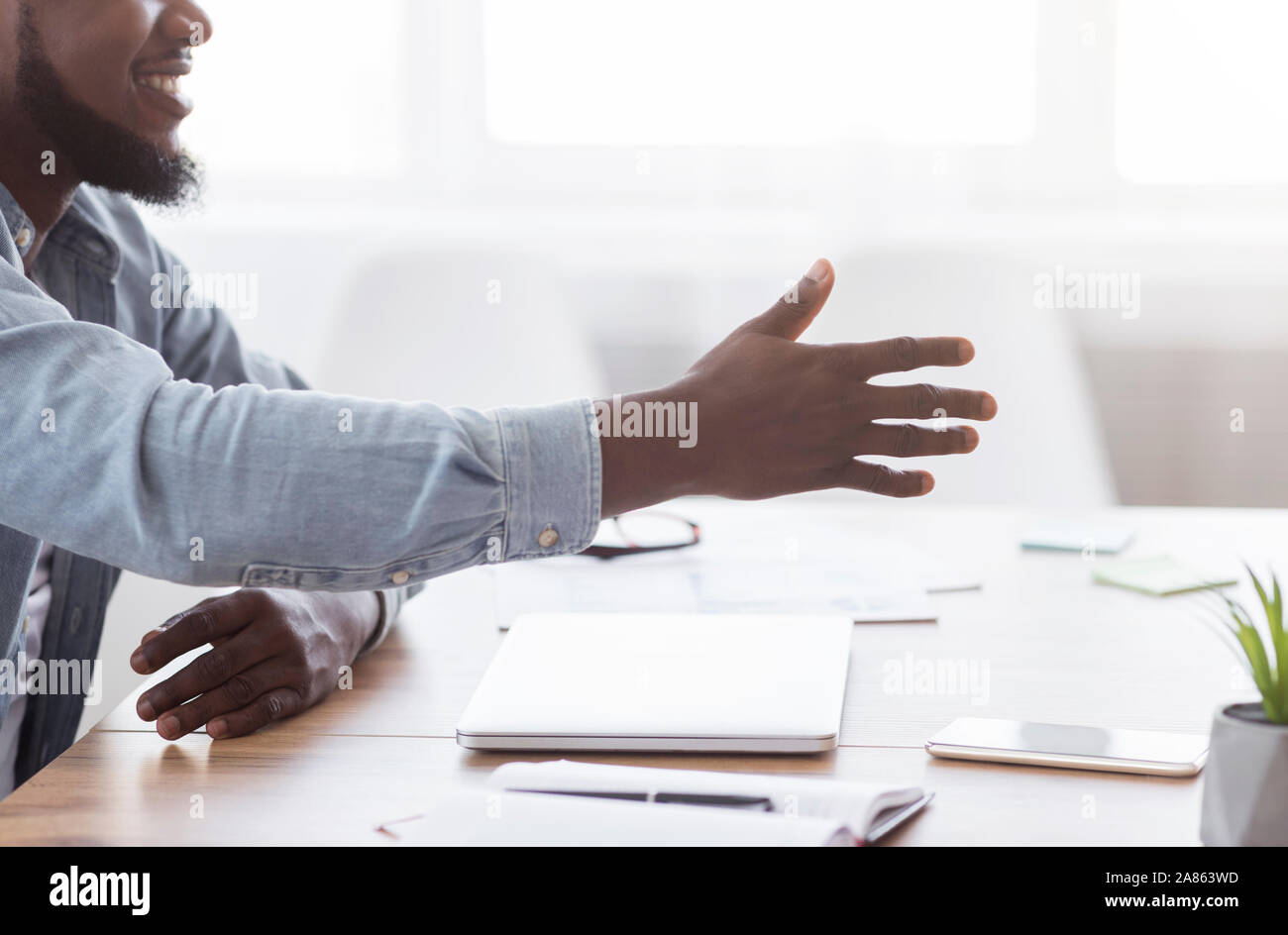 Black entrepreneur giving hand for handshake proposes partnership Stock ...