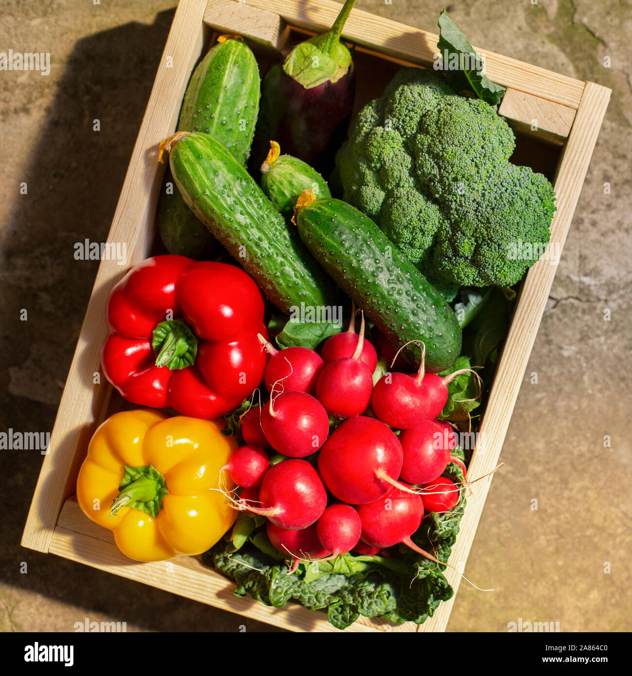 Fresh Vegetables in sun lights in eco wooden box Stock Photo - Alamy