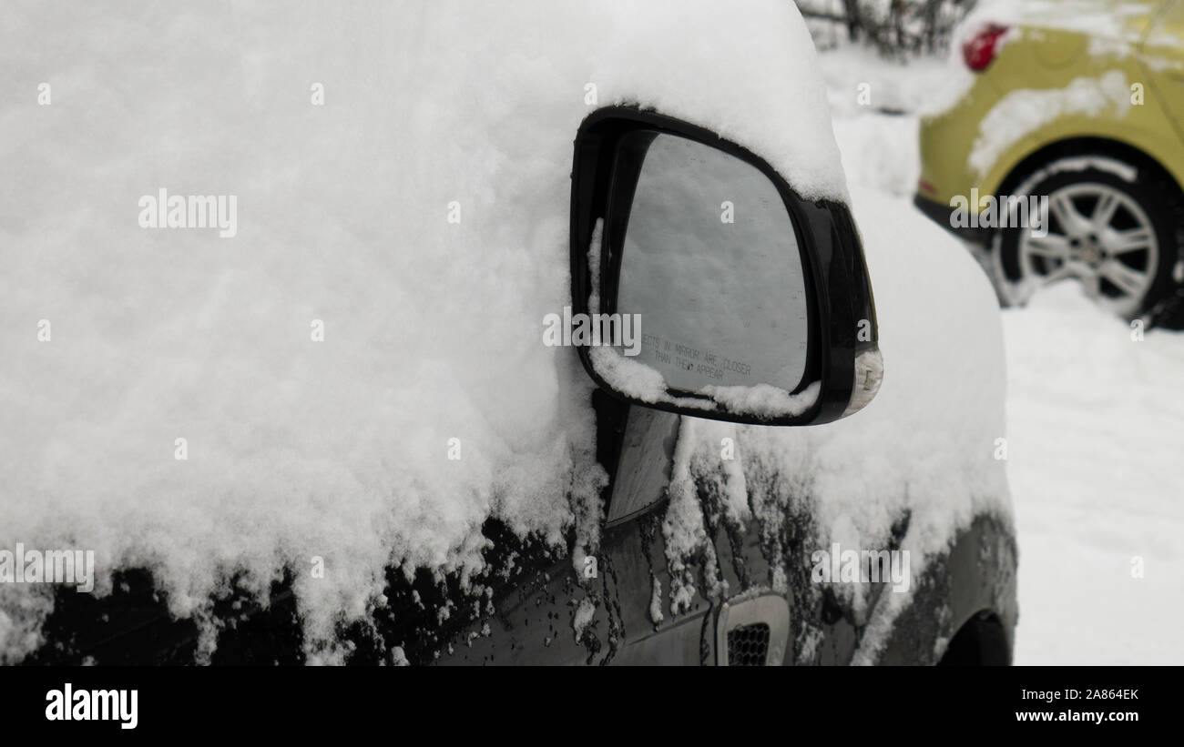View mirror covered with snow Stock Photo - Alamy