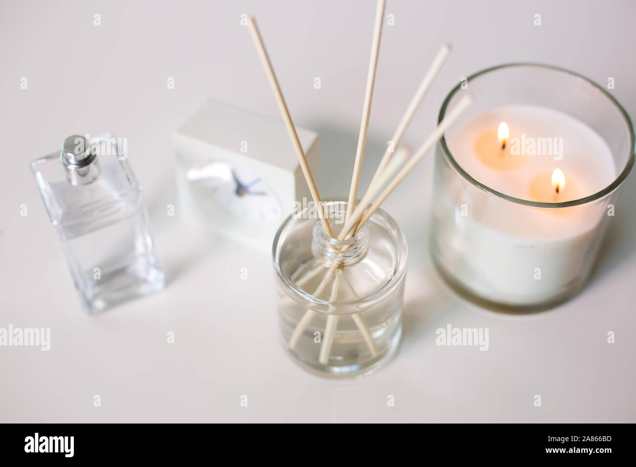 aroma reed diffuser, burning candle and perfume Stock Photo - Alamy