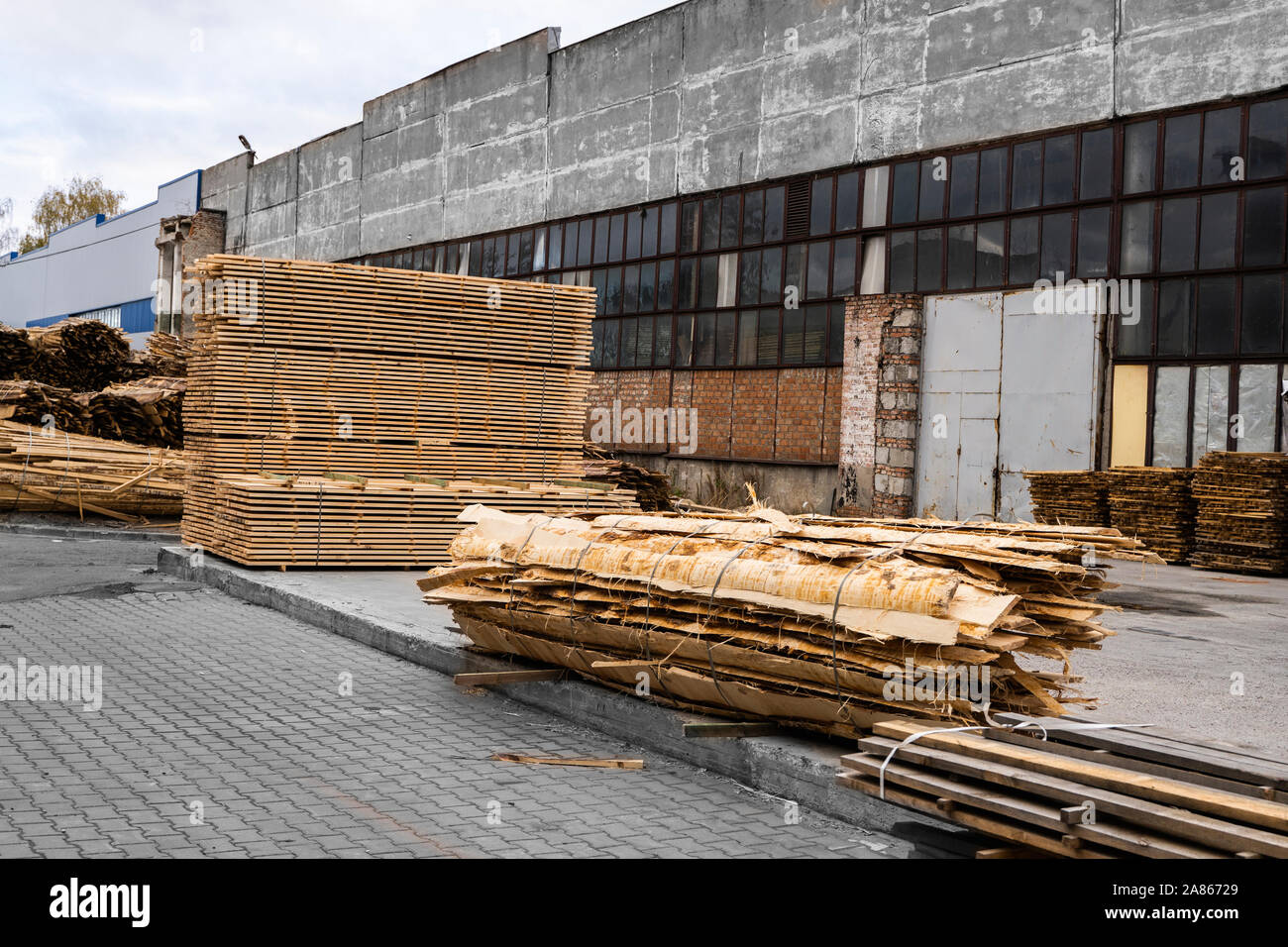 Piles of wooden boards in the sawmill, planking. Warehouse for sawing ...