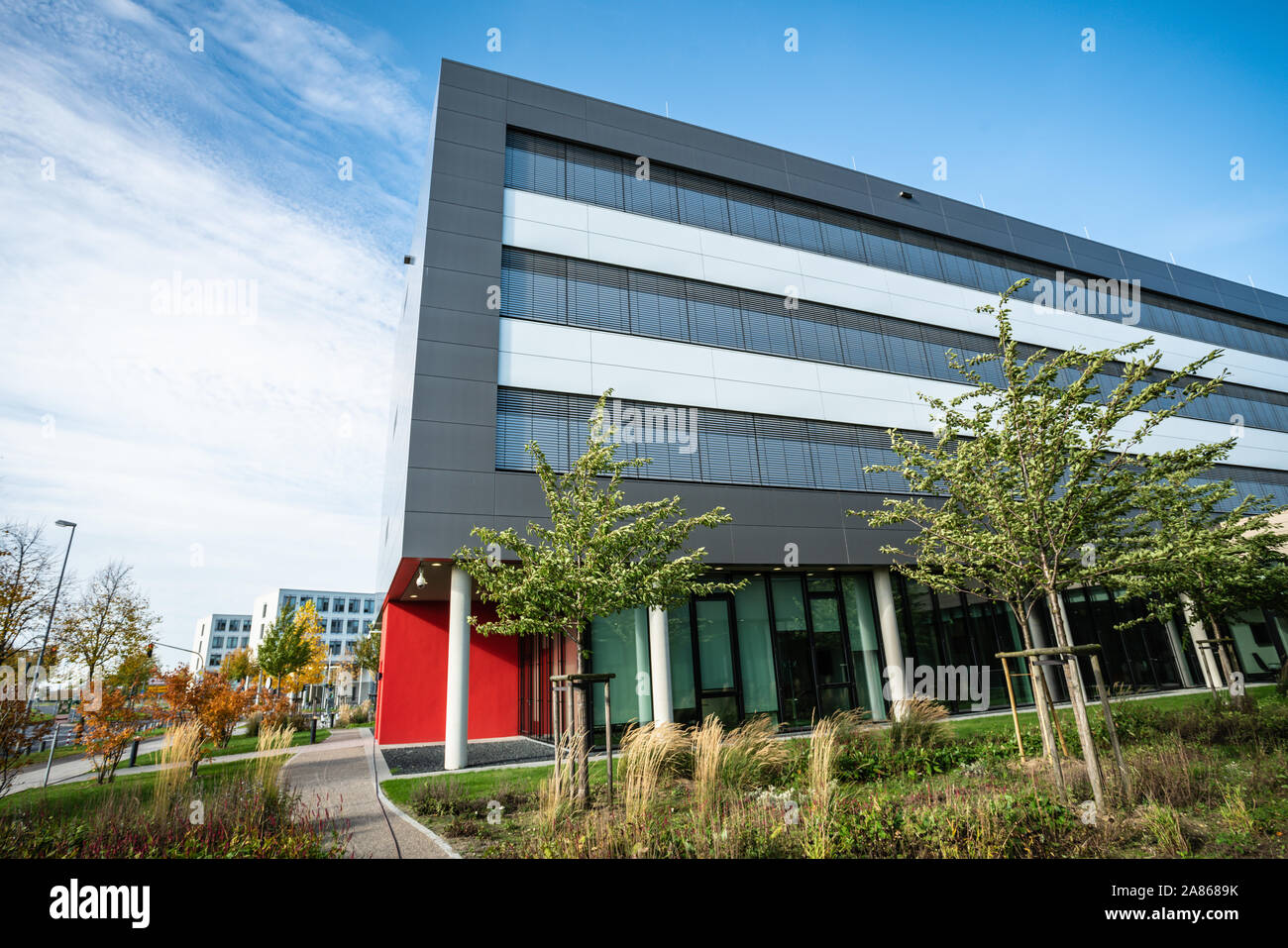 modern office building against a nice blue sky Stock Photo - Alamy